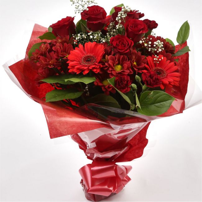 Lavish Red BouquetAdd a hint of paradise to someone's life with this ...